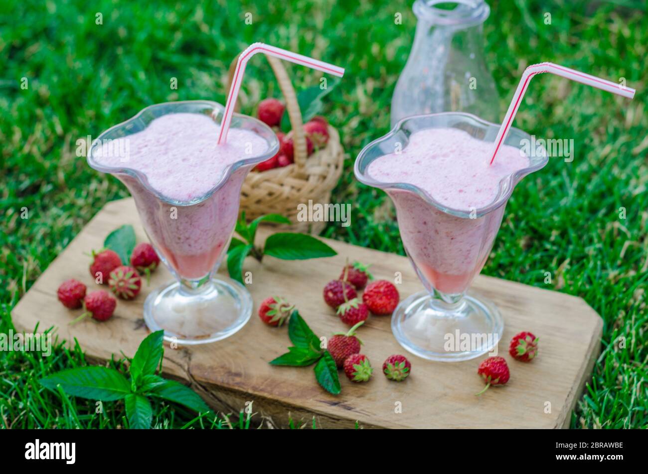 Strawberrie smoothie outside summer, basket with strawberries Stock ...