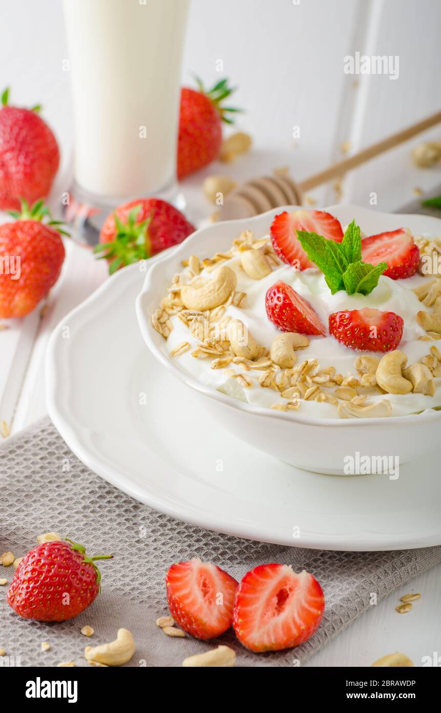 Domestic yogurt with granola strawberries, milk shake Stock Photo - Alamy
