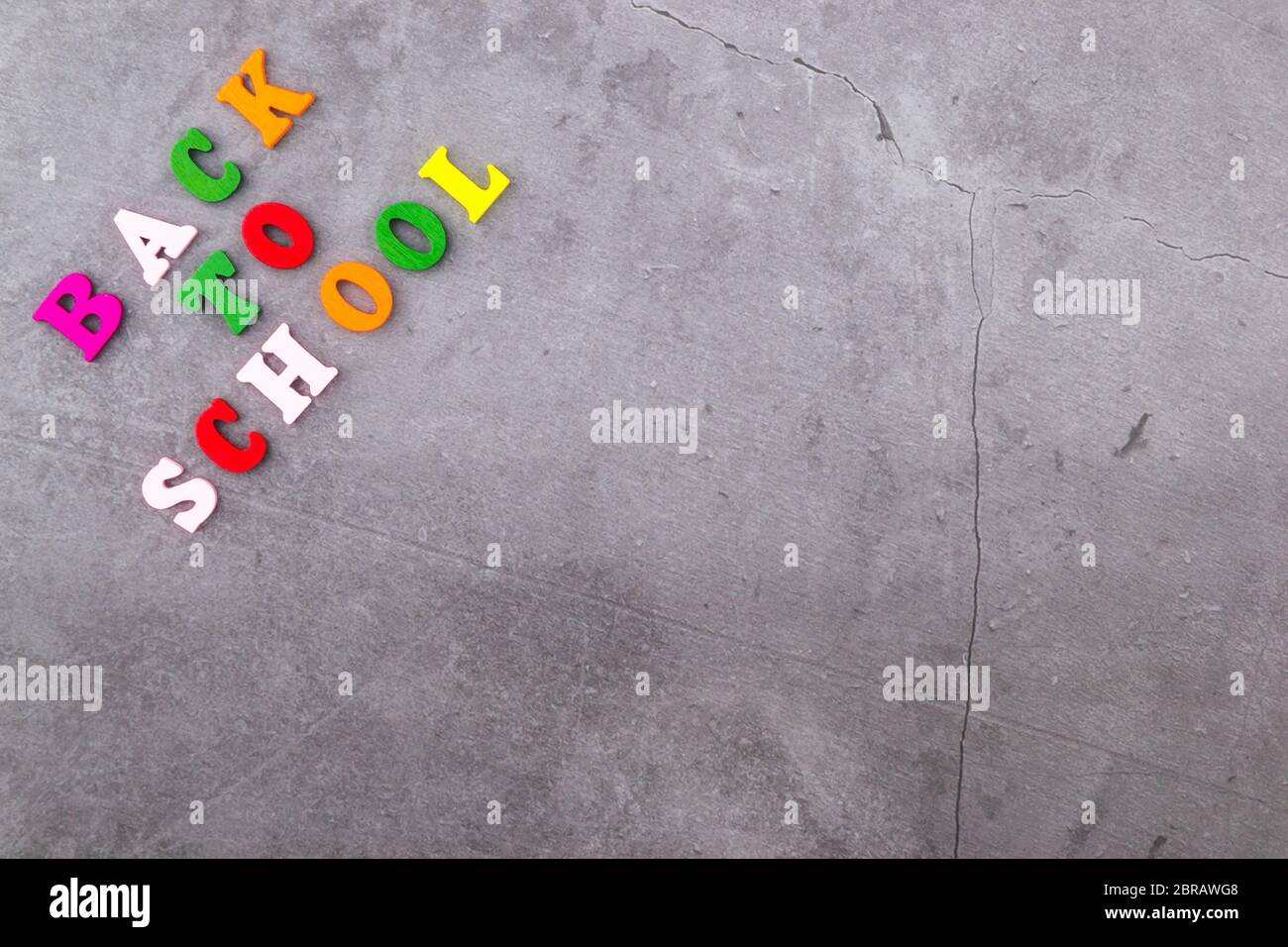 The layout of school supplies on a dark gray background. The view from ...