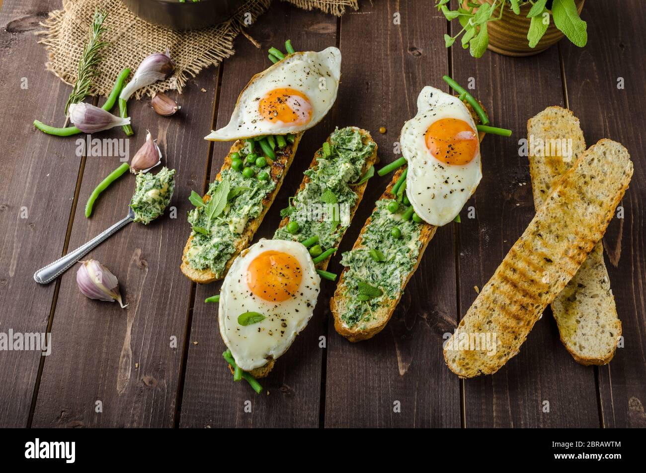 Healthy rustic baguette with herb butter and vegetables Stock Photo - Alamy