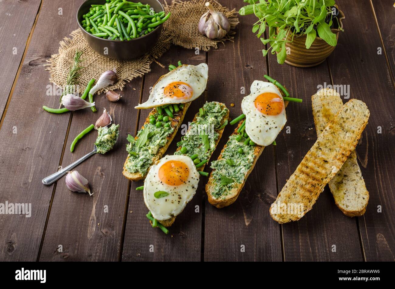 Healthy rustic baguette with herb butter and vegetables Stock Photo - Alamy