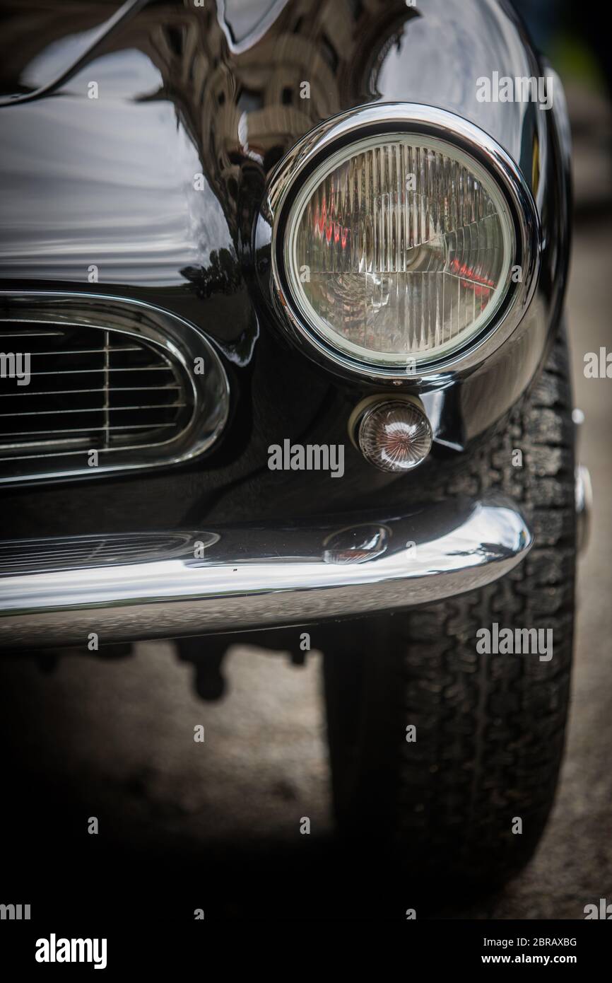 Close up vertical image of the headlight of a vintage classic car Stock ...