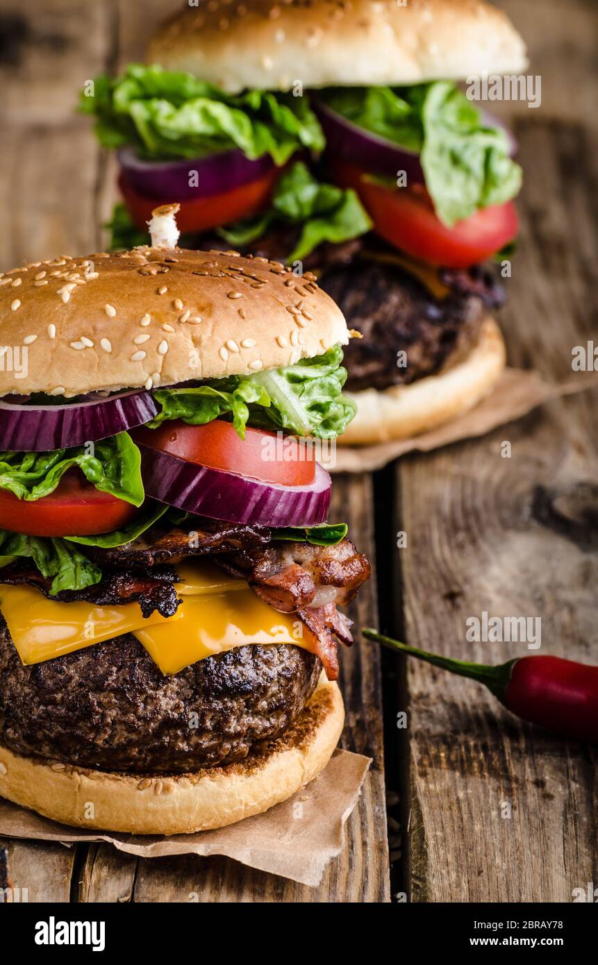 Beef burger rustic style, with chilli peppers and homemade french fries ...