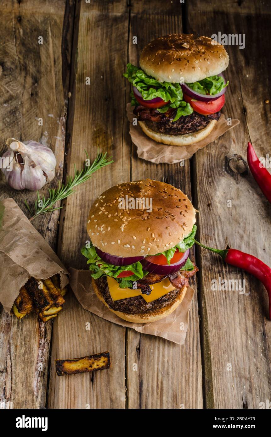 Beef burger rustic style, with chilli peppers and homemade french fries ...