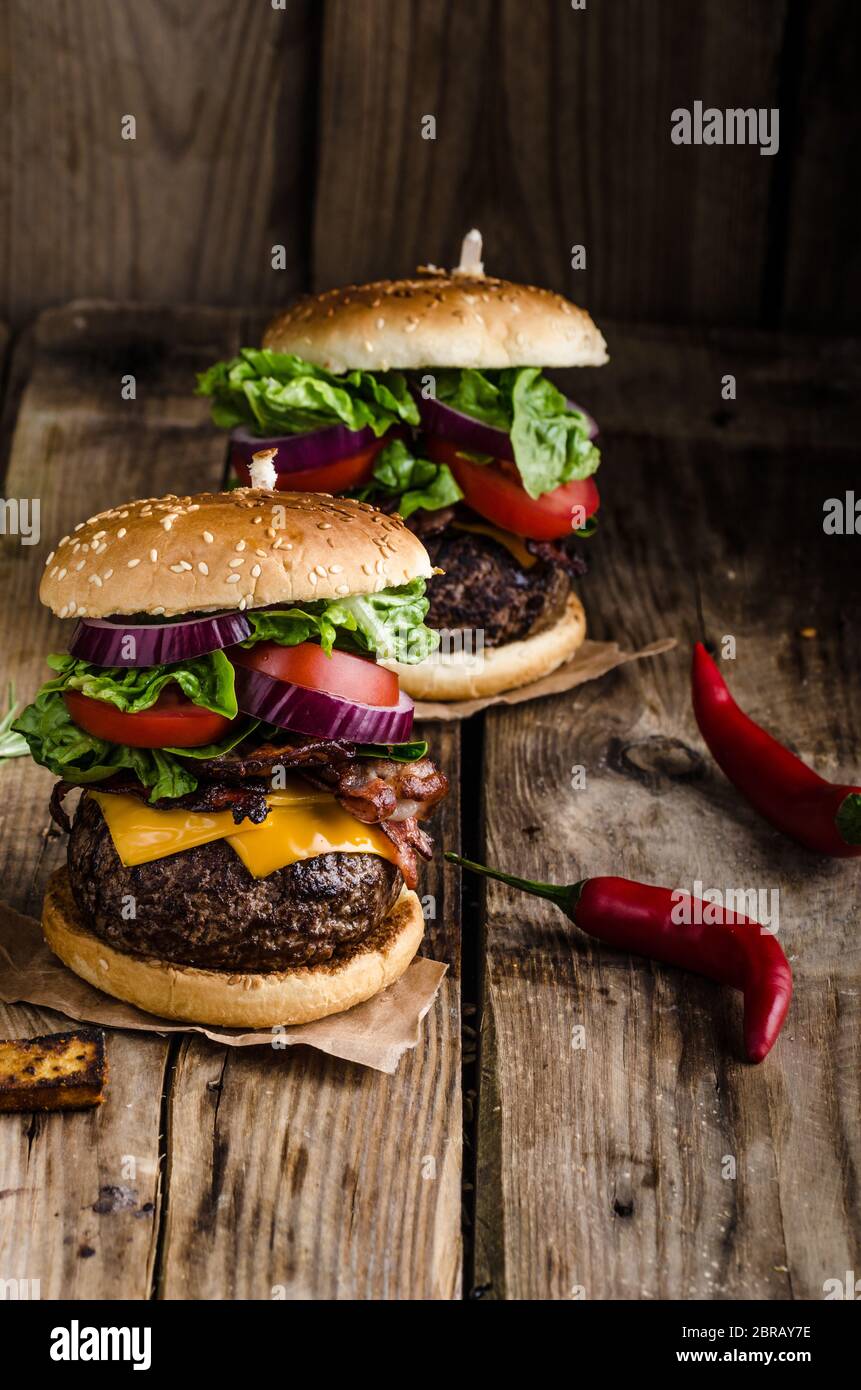 Beef burger rustic style, with chilli peppers and homemade french fries ...