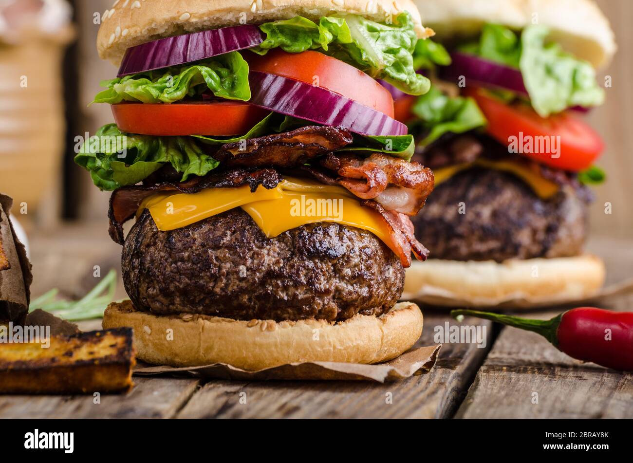 Beef burger rustic style, with chilli peppers and homemade french fries ...