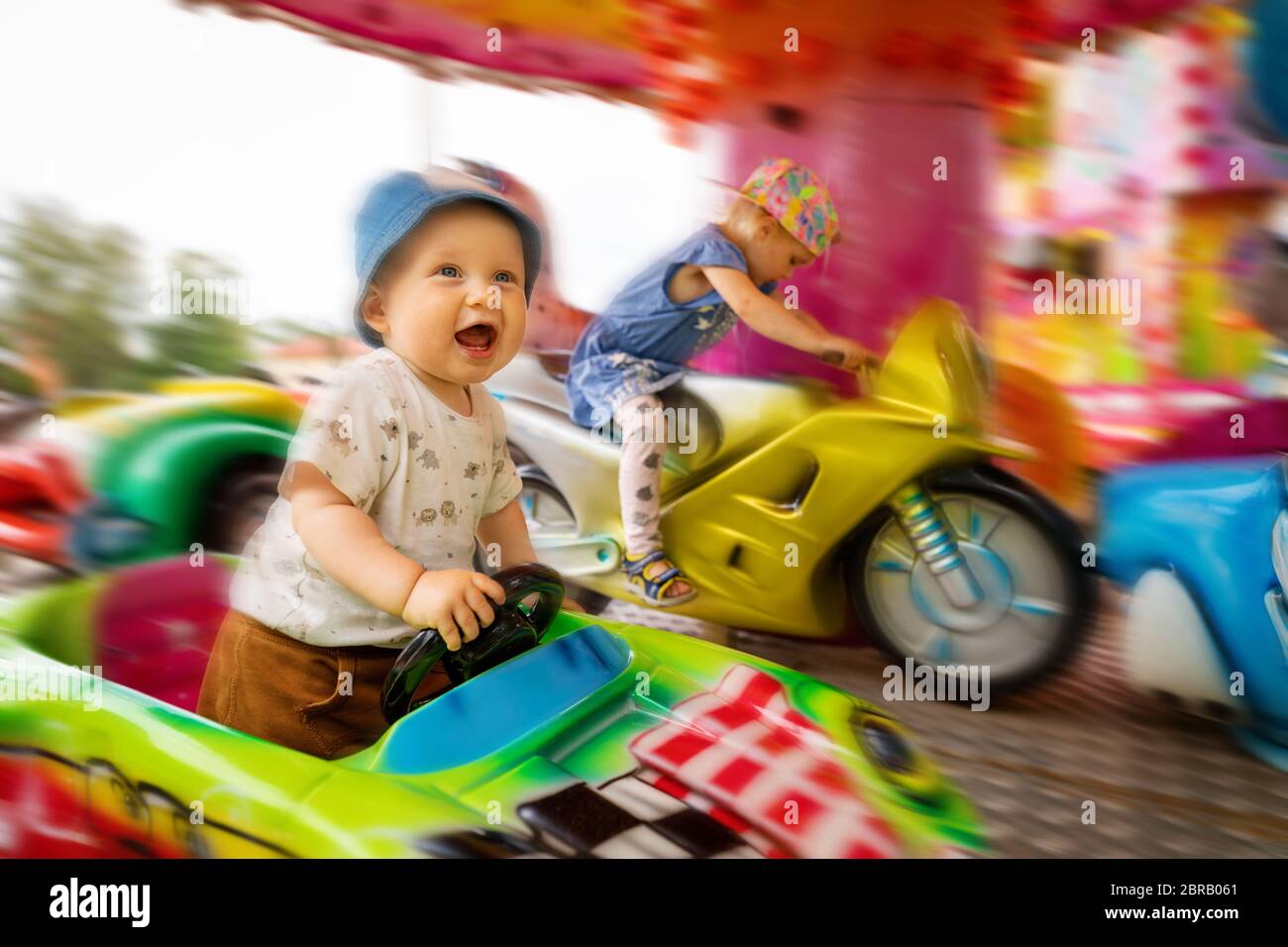 Little children carousel hi-res stock photography and images - Alamy