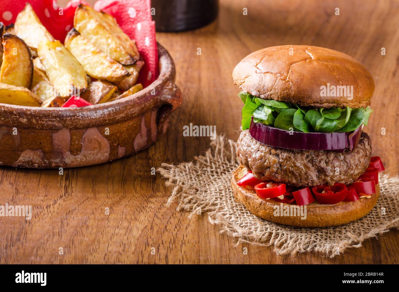 Beef burger with chilli, homemade bun and delicious beef seasoned meat ...