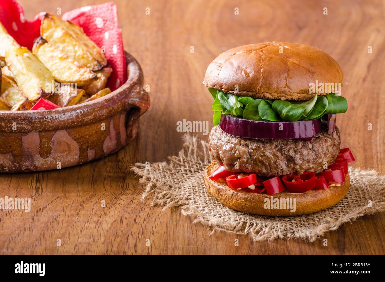 Beef burger with chilli, homemade bun and delicious beef seasoned meat ...