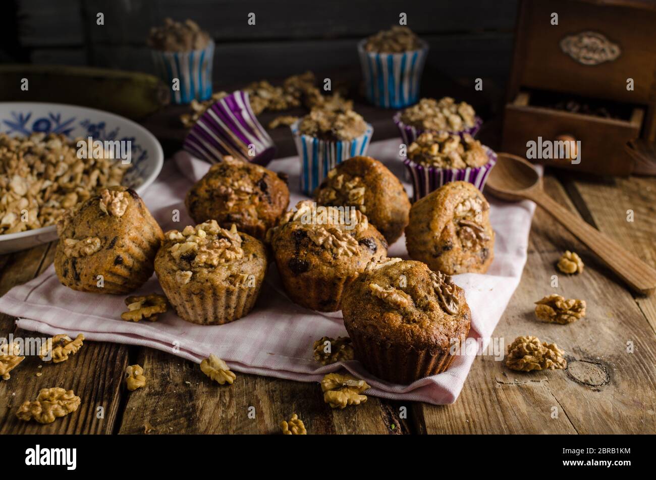 Whole grain muffins with dark chocolate and nuts, rustic style Stock ...