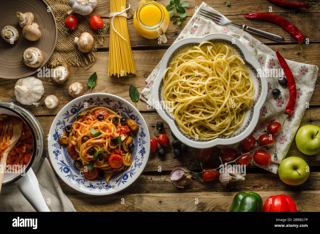 Pasta with olives, tomatoes and basil, fresh pasta, orange juice Stock ...