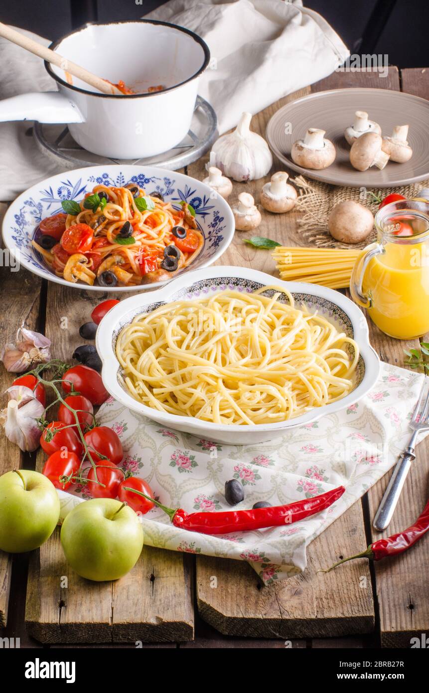 Pasta with olives, tomatoes and basil, fresh pasta, orange juice Stock ...