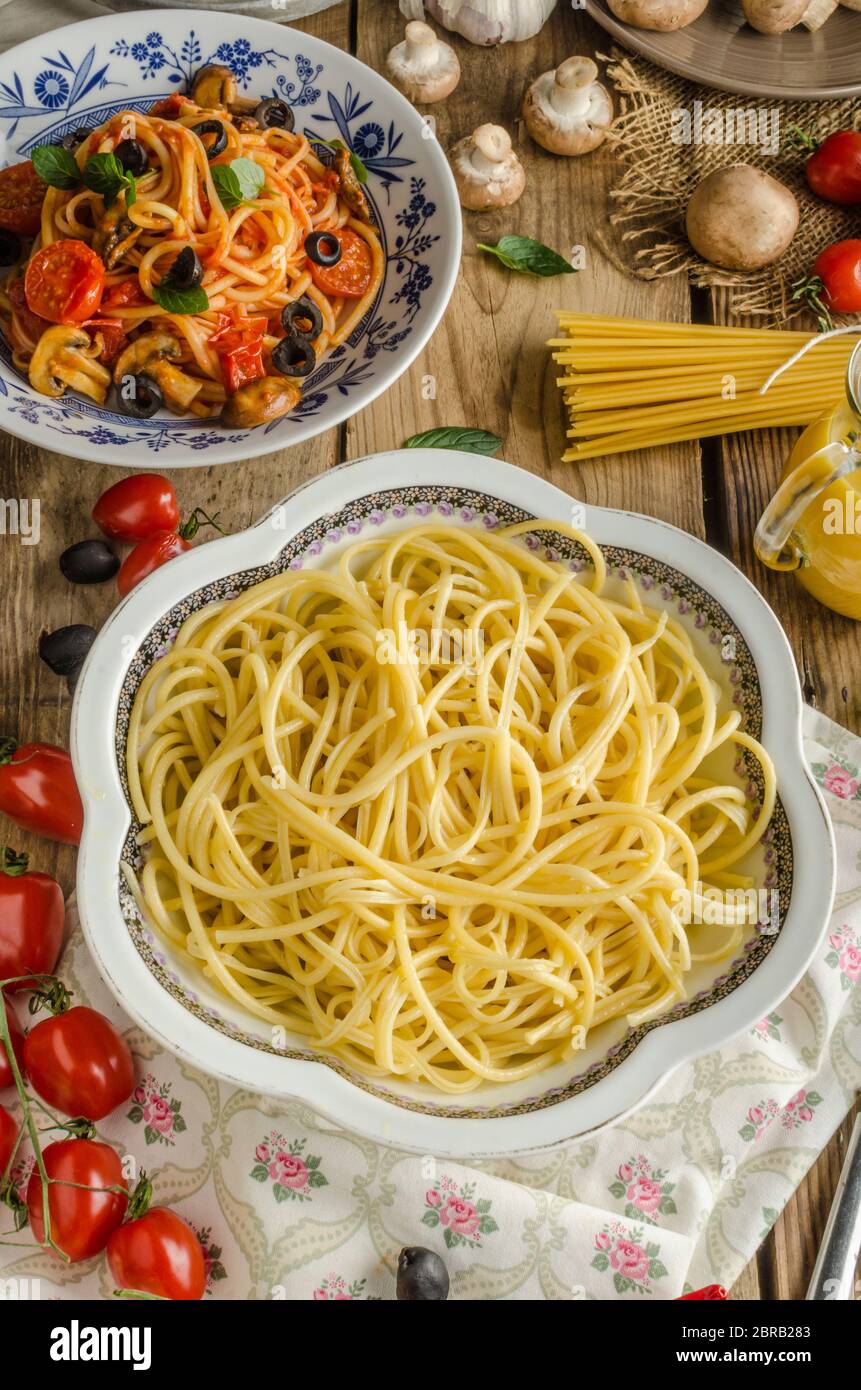 Pasta with olives, tomatoes and basil, fresh pasta, orange juice Stock ...