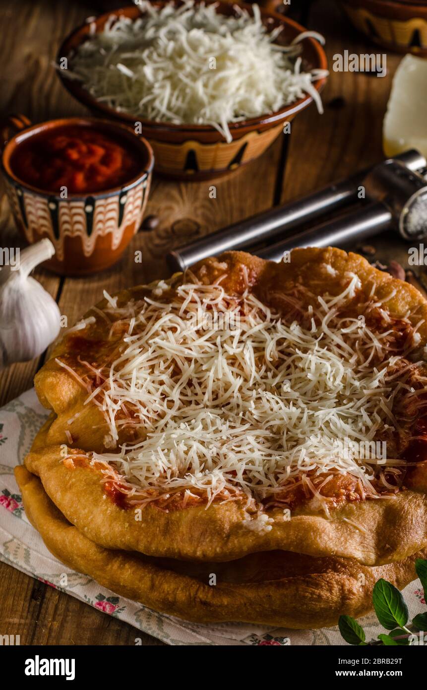 Traditional Langos are originally Hungarian fried pancakes made from ...