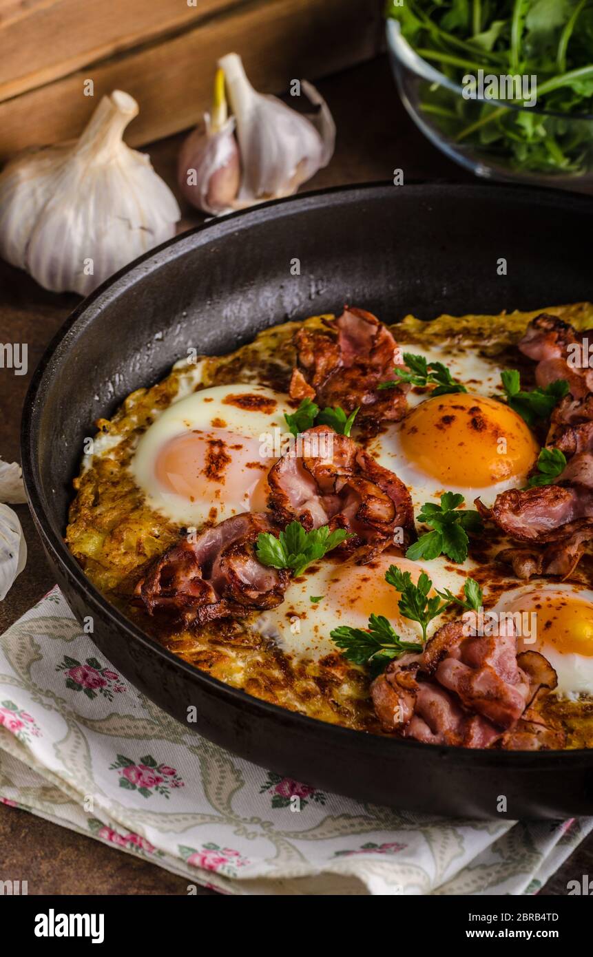 American Hash Browns potato with fried egg, bacon and herbs, real ...