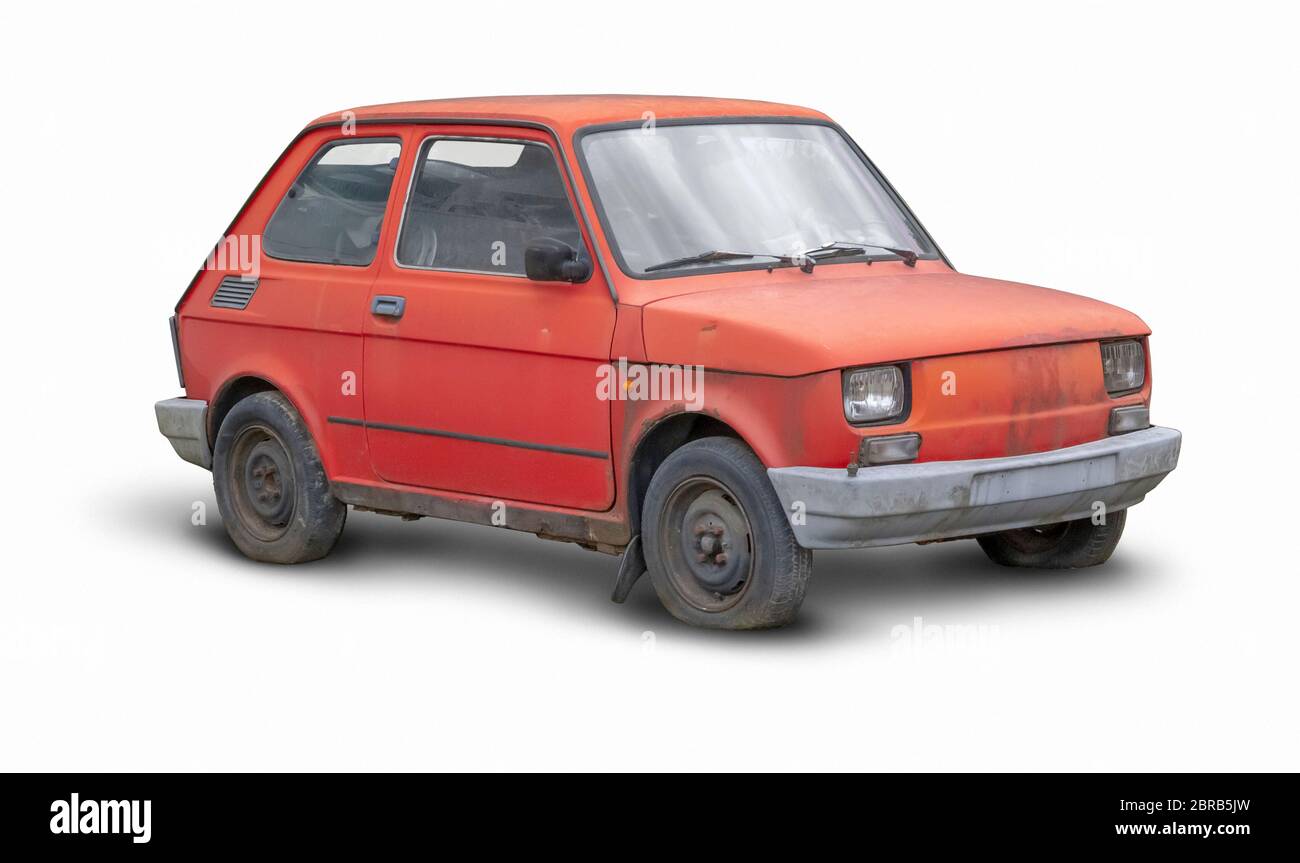 small rundown red compact car in white back with shadow Stock Photo - Alamy