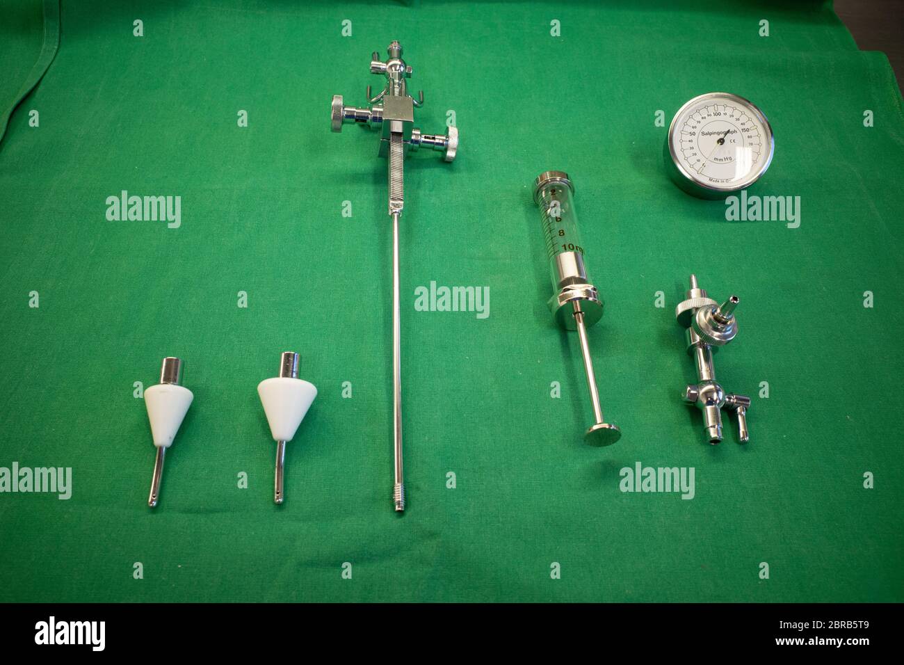 a salpingoscope is placed on a surgical drape to show the color of the ...