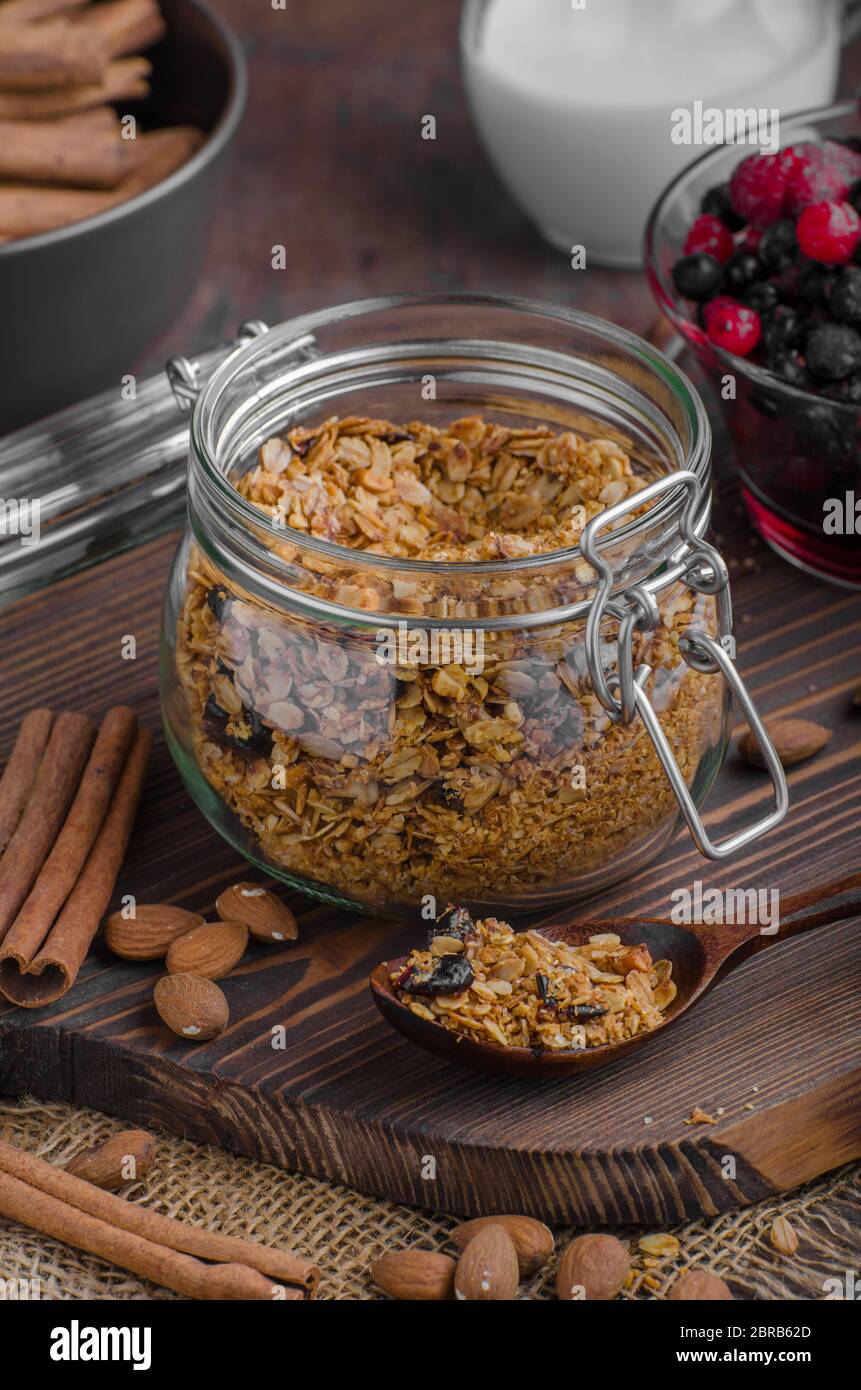 Baked granola with berries, delish simple meal Stock Photo - Alamy