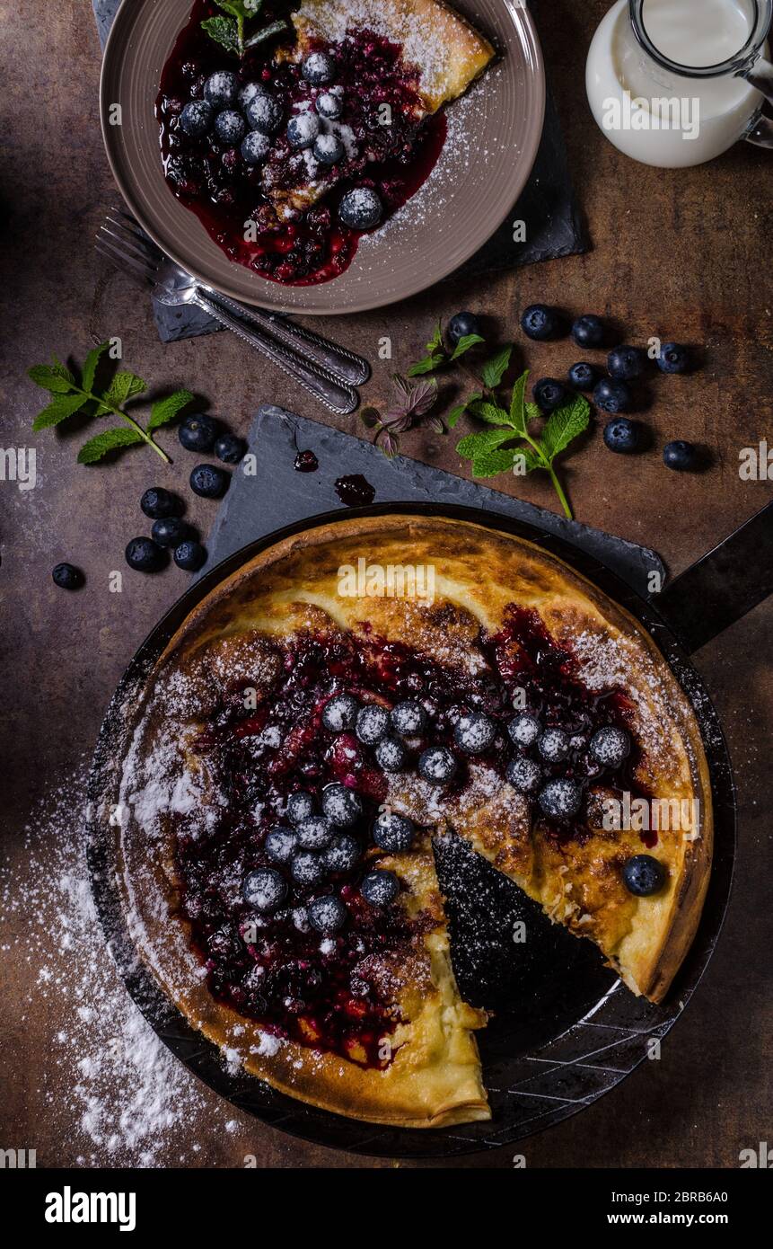 Dutch style pancake named dutch baby, baked in oven on iron skillet ...