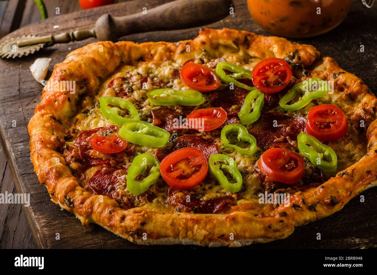 Rustic old style vintage pizza, wood board, fresh food Stock Photo - Alamy