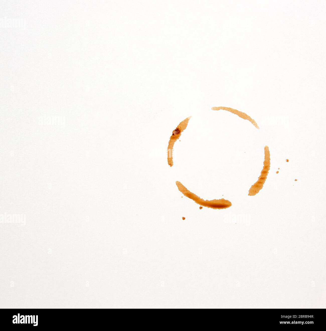 round imprint of a coffee cup on a white paper background, close up ...