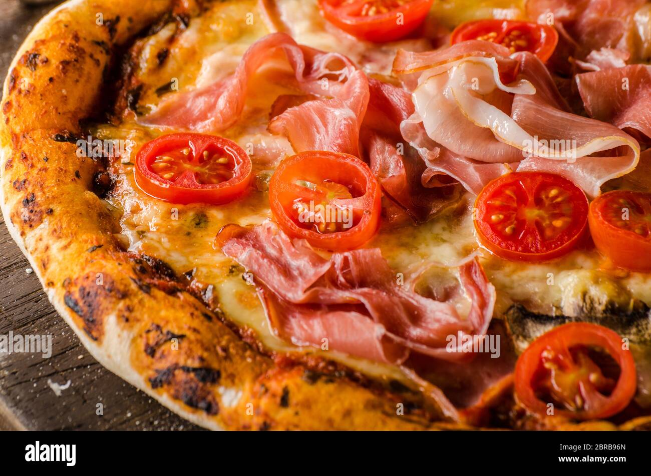 Rustic old style vintage pizza, wood board, fresh food Stock Photo - Alamy