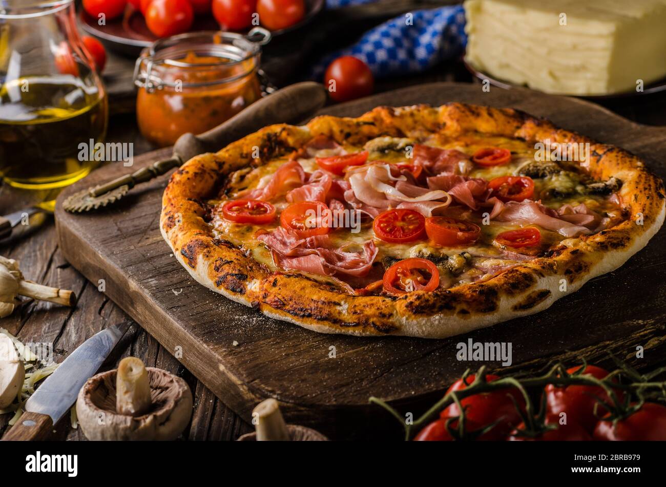 Rustic old style vintage pizza, wood board, fresh food Stock Photo - Alamy