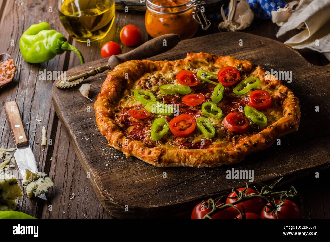 Rustic old style vintage pizza, wood board, fresh food Stock Photo - Alamy