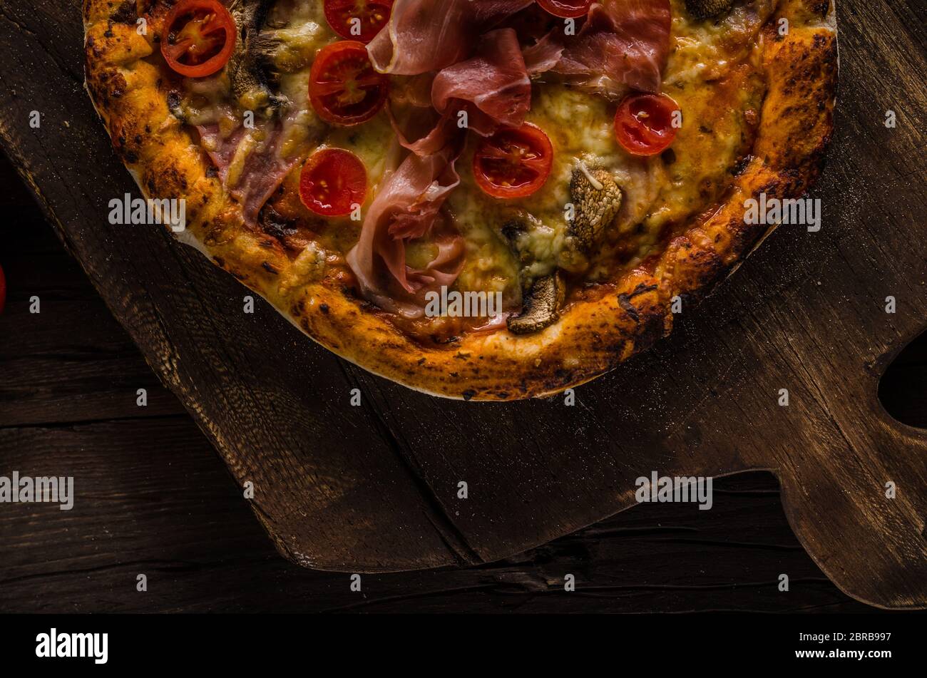 Rustic old style vintage pizza, wood board, fresh food Stock Photo - Alamy