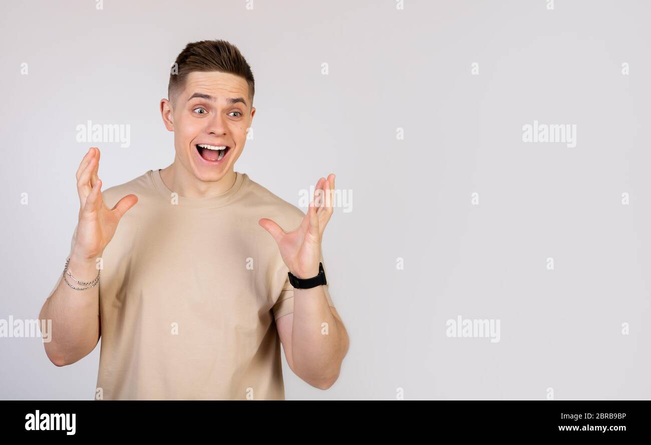 The guy looks very cute excited, seeing a cute little kitten, is going ...