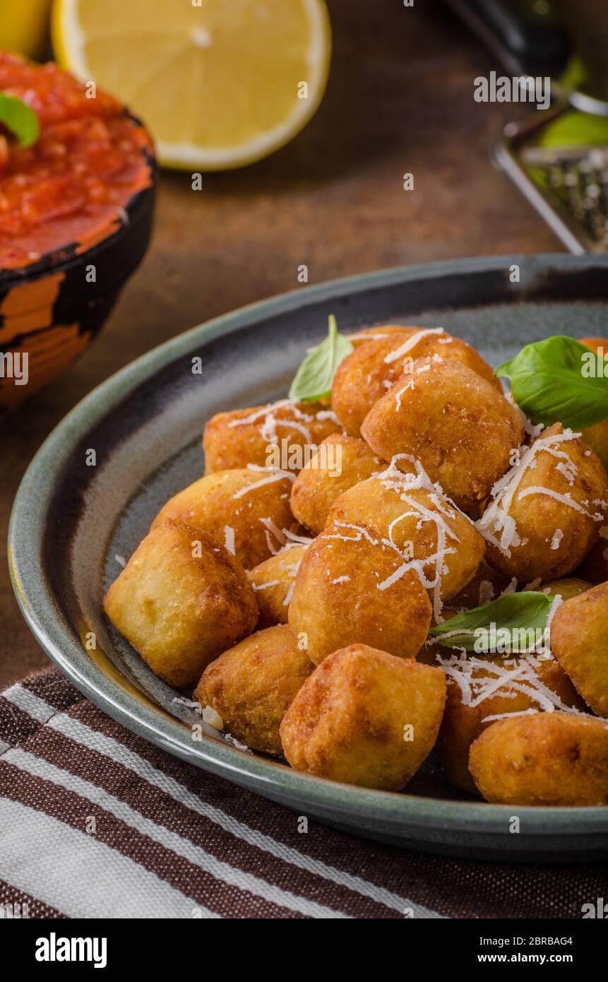 Golden fried mini croquette with parmesan cheese, delicious with tomato ...