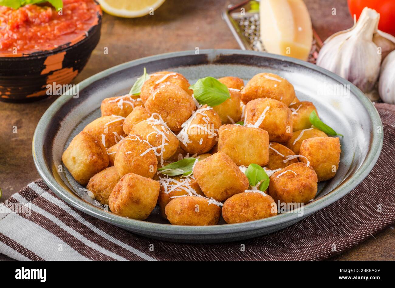 Golden fried mini croquette with parmesan cheese, delicious with tomato ...