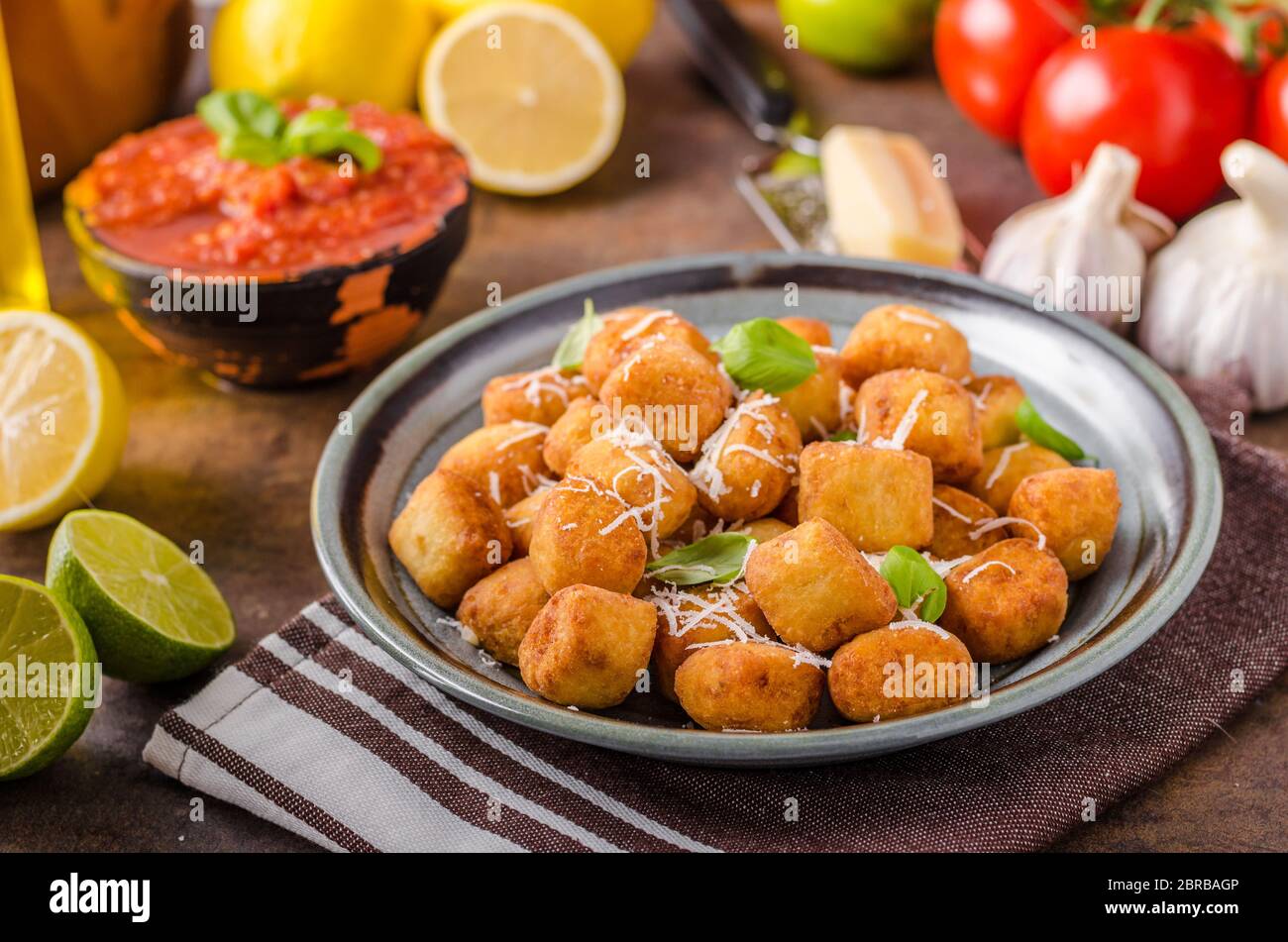 Golden fried mini croquette with parmesan cheese, delicious with tomato ...