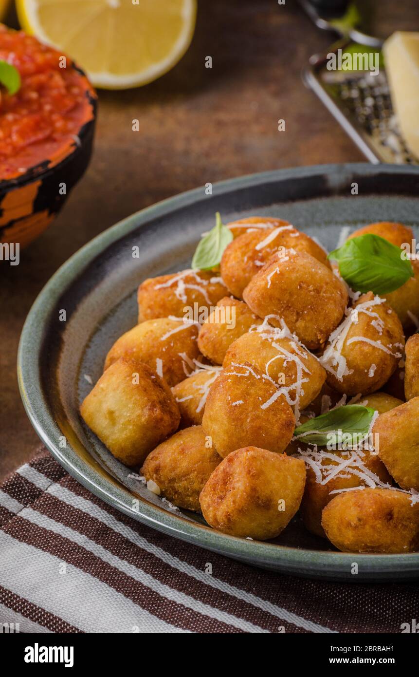 Golden fried mini croquette with parmesan cheese, delicious with tomato ...