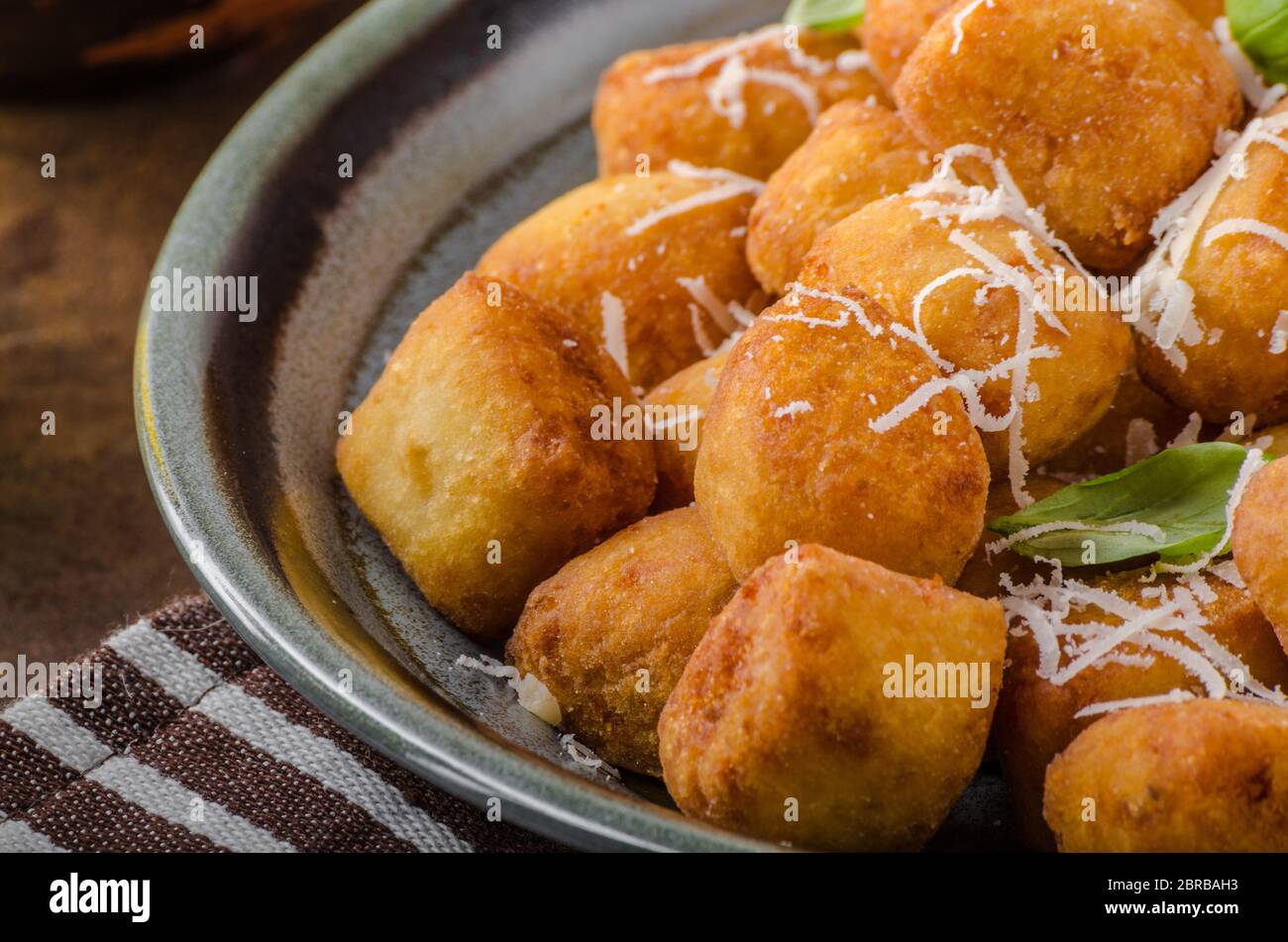 Golden fried mini croquette with parmesan cheese, delicious with tomato ...