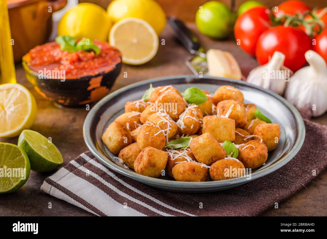Golden fried mini croquette with parmesan cheese, delicious with tomato ...