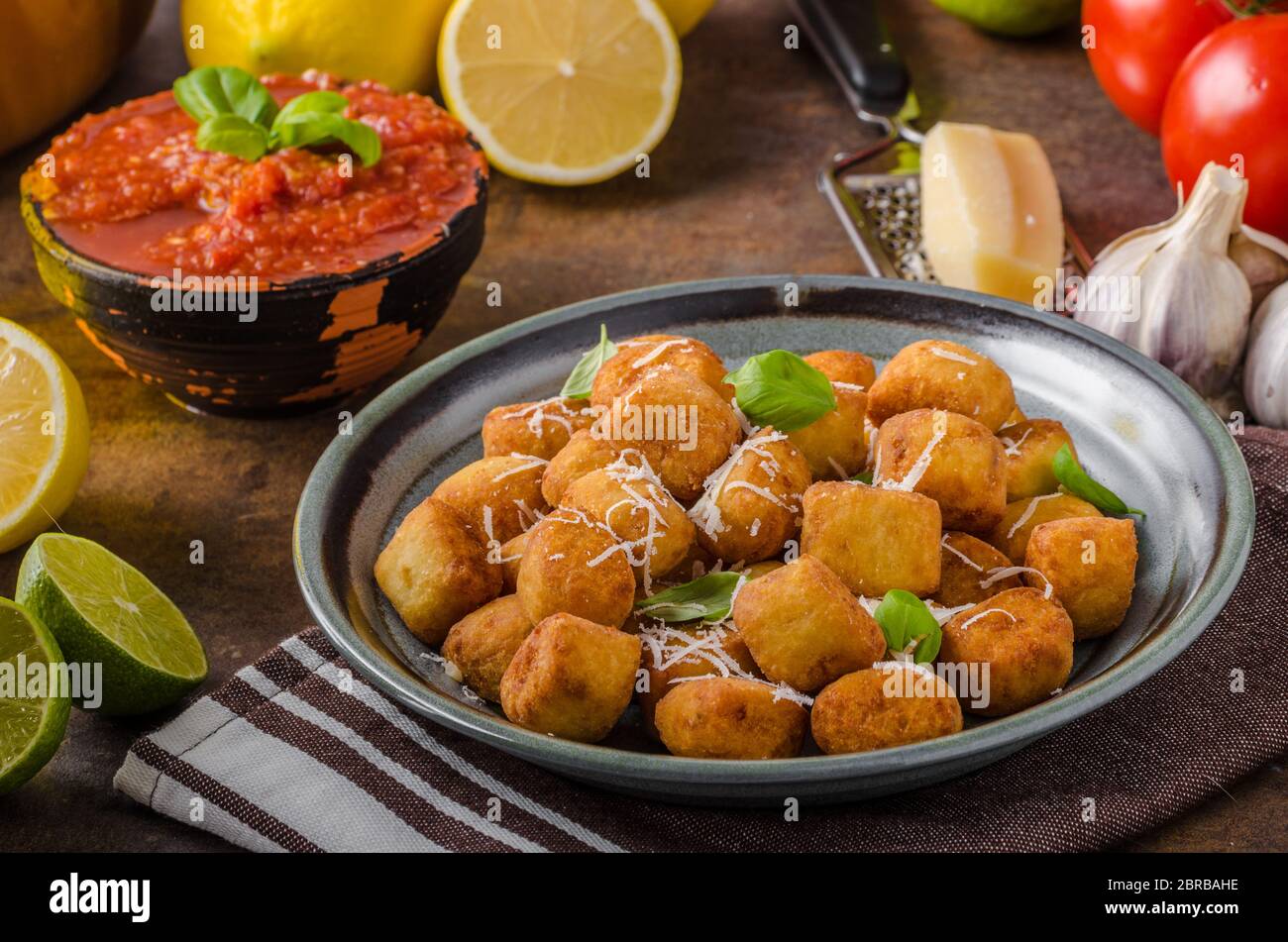 Golden fried mini croquette with parmesan cheese, delicious with tomato ...