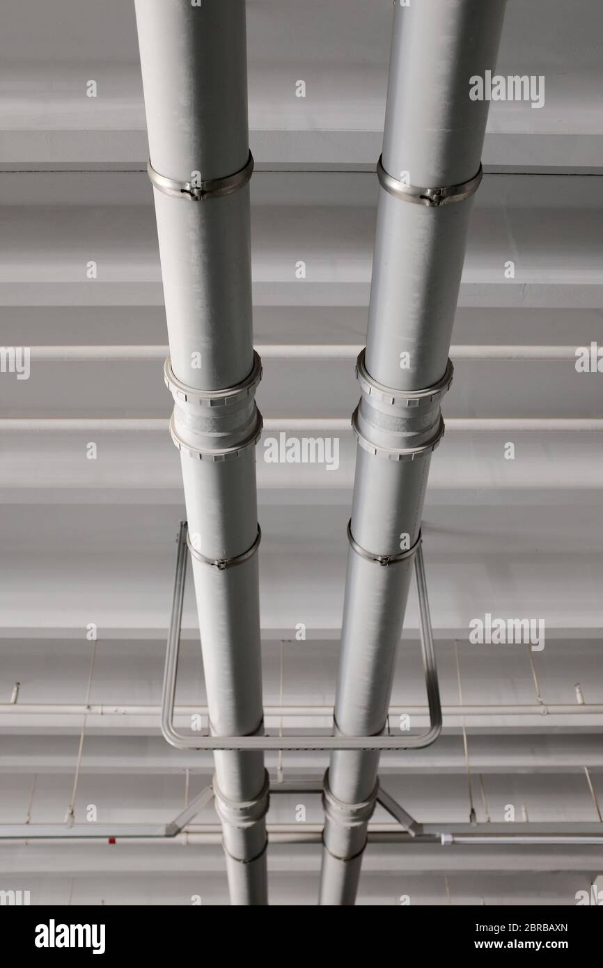 Industrial Pipes Overhead in a Building Under Construction Stock Photo ...