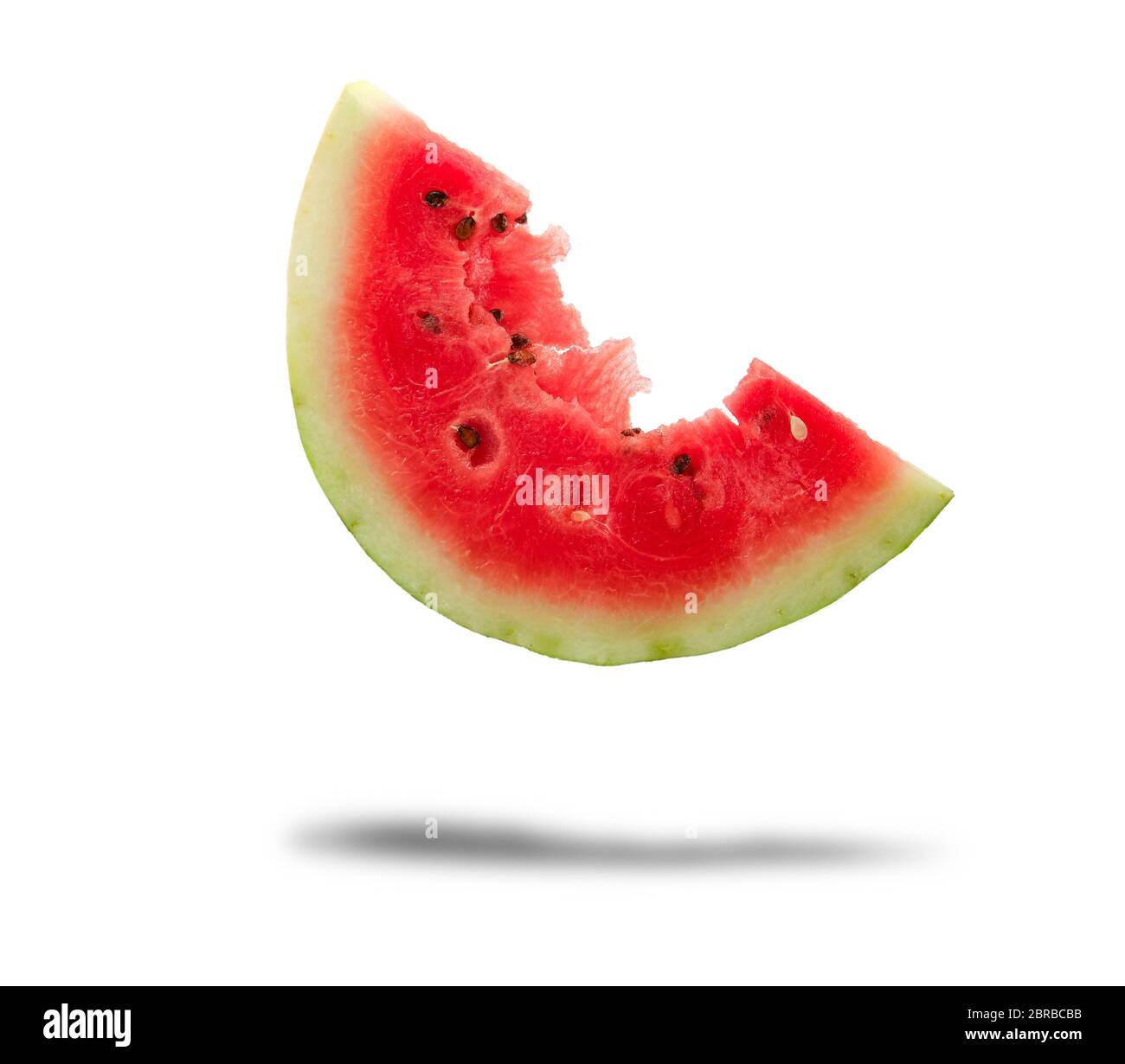 bitten off a piece of ripe red round watermelon with seeds on a white ...