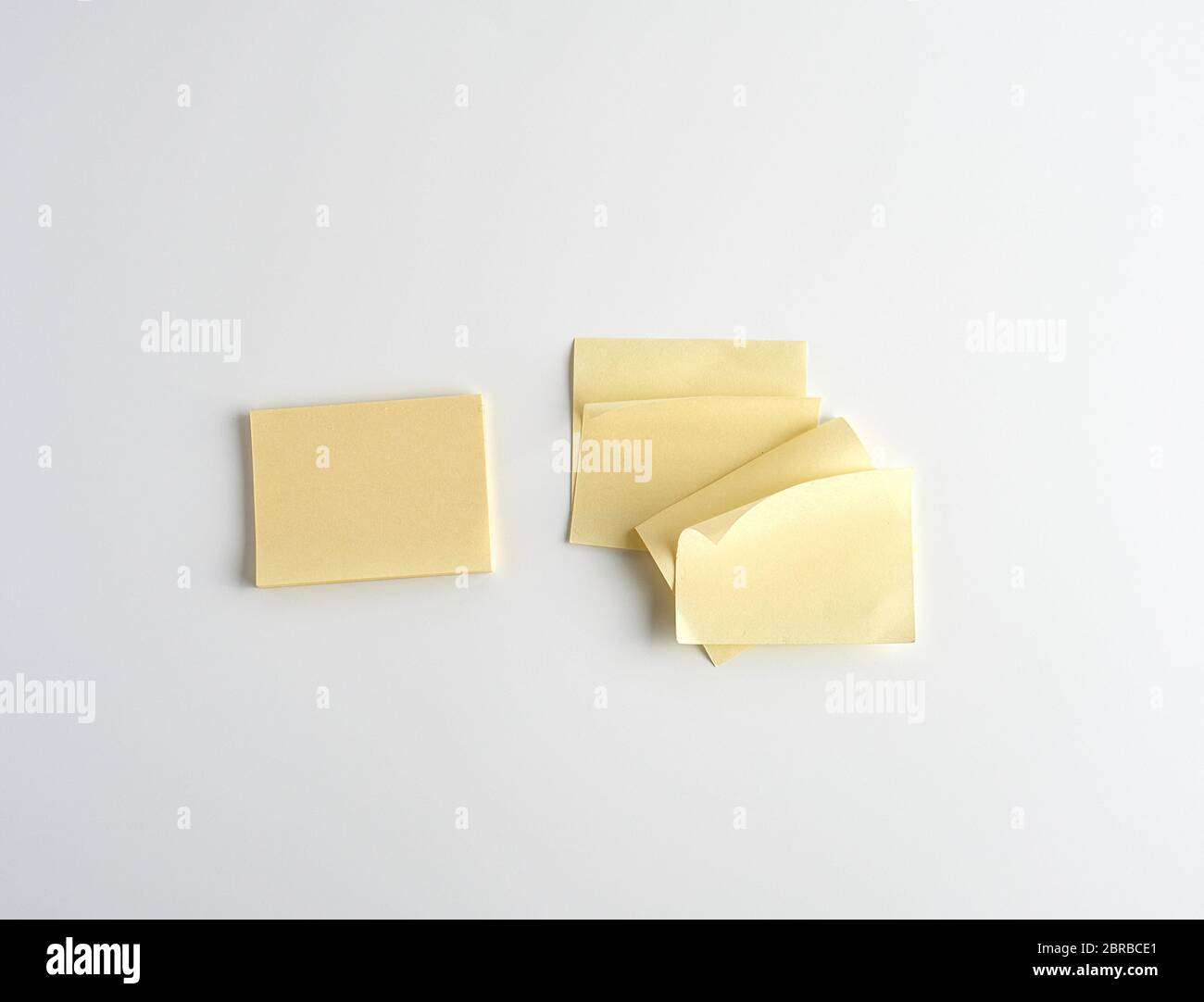 stack of yellow paper stickers on white background, close up Stock ...