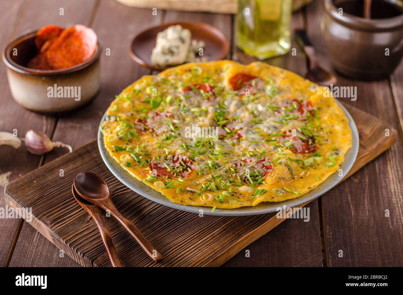 Salami blue cheese omelette, herbs and delish cheese inside Stock Photo ...
