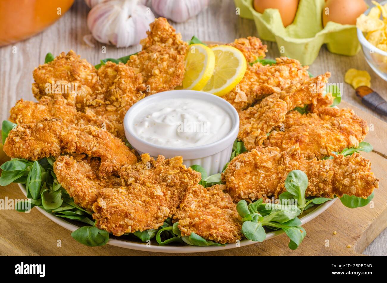 Chicken strips with delish garlic dip, food photography Stock Photo - Alamy