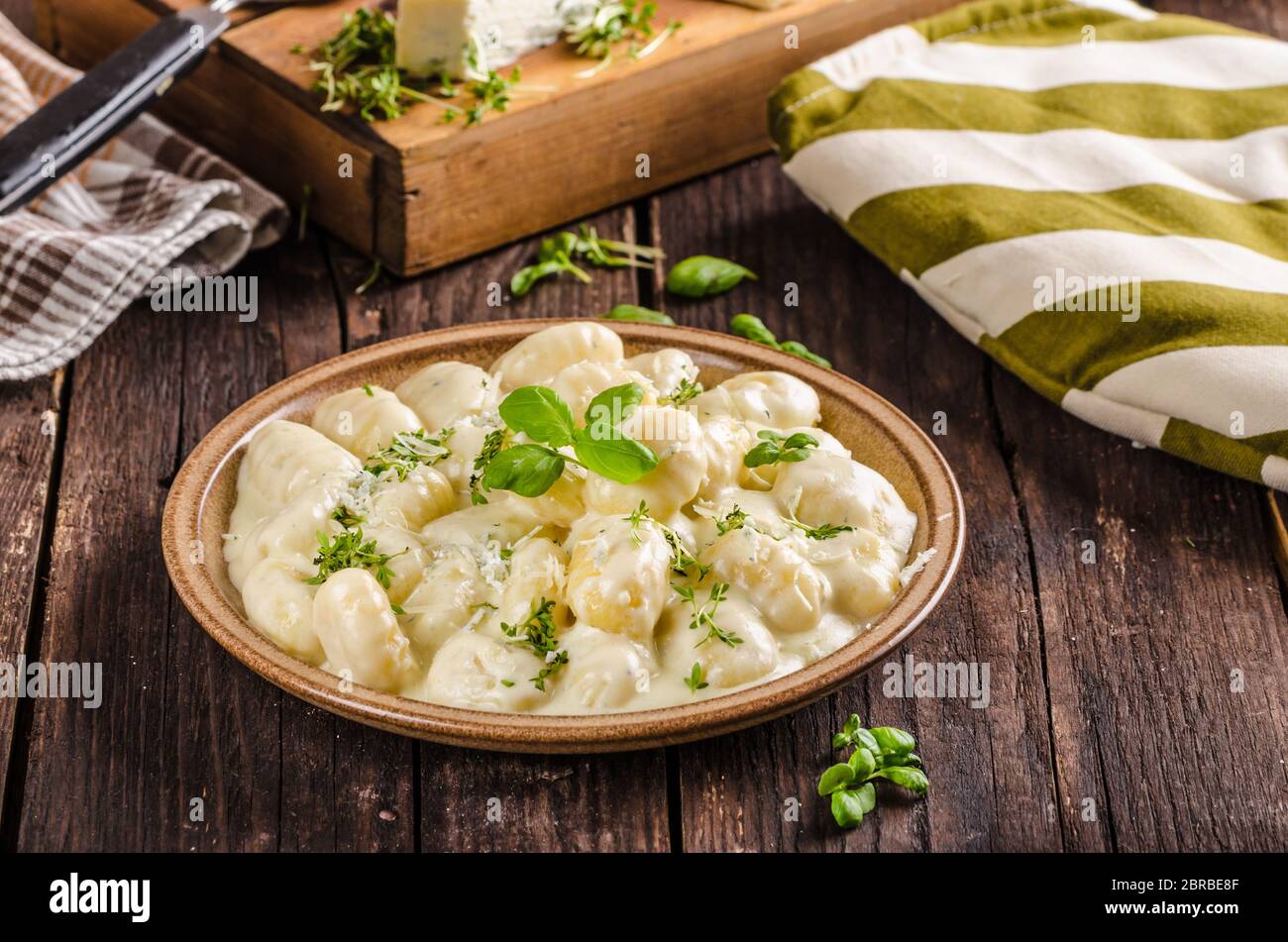 Cheese gnocchi with blue cheese sauce and galic, herbs on top, delish ...