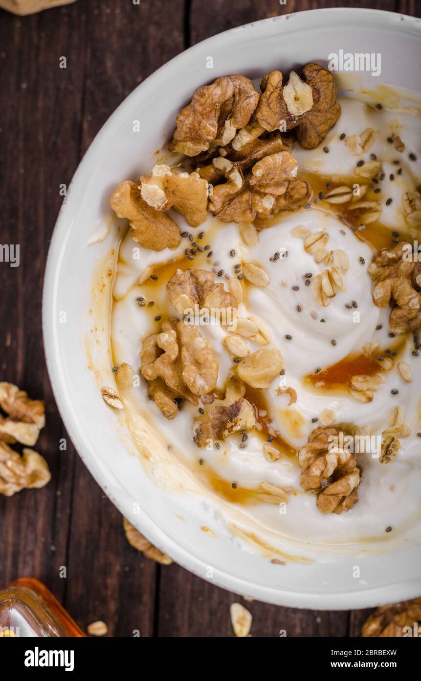 Fresh cheese with honey and walnuts, food photography, food stylind ...