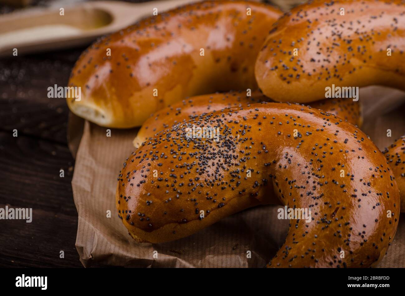 Poppy seeds roll pastry, other pastries behind, food photography Stock ...