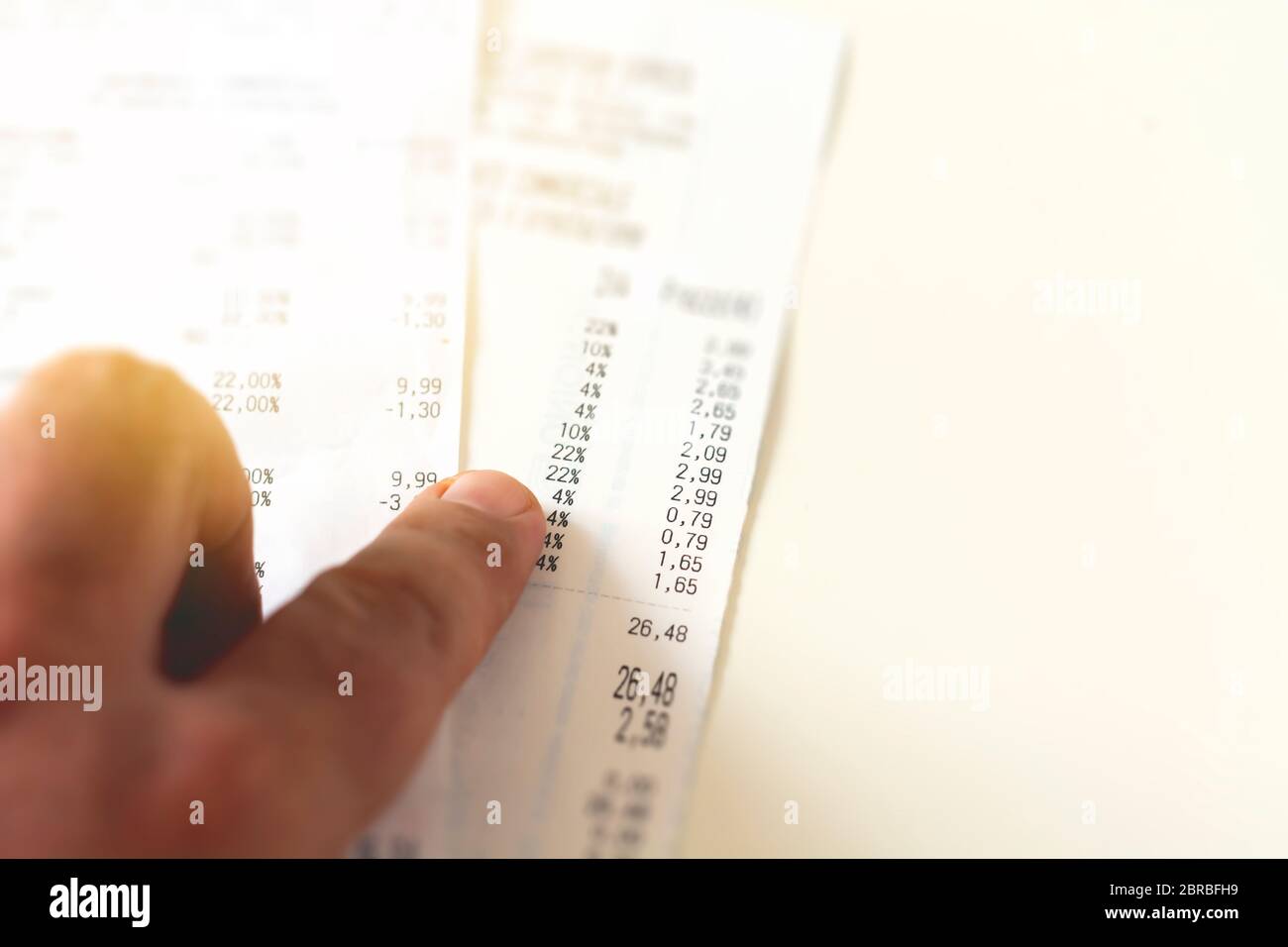 checking a receipt by analyzing the numbers, expenses and profits ...