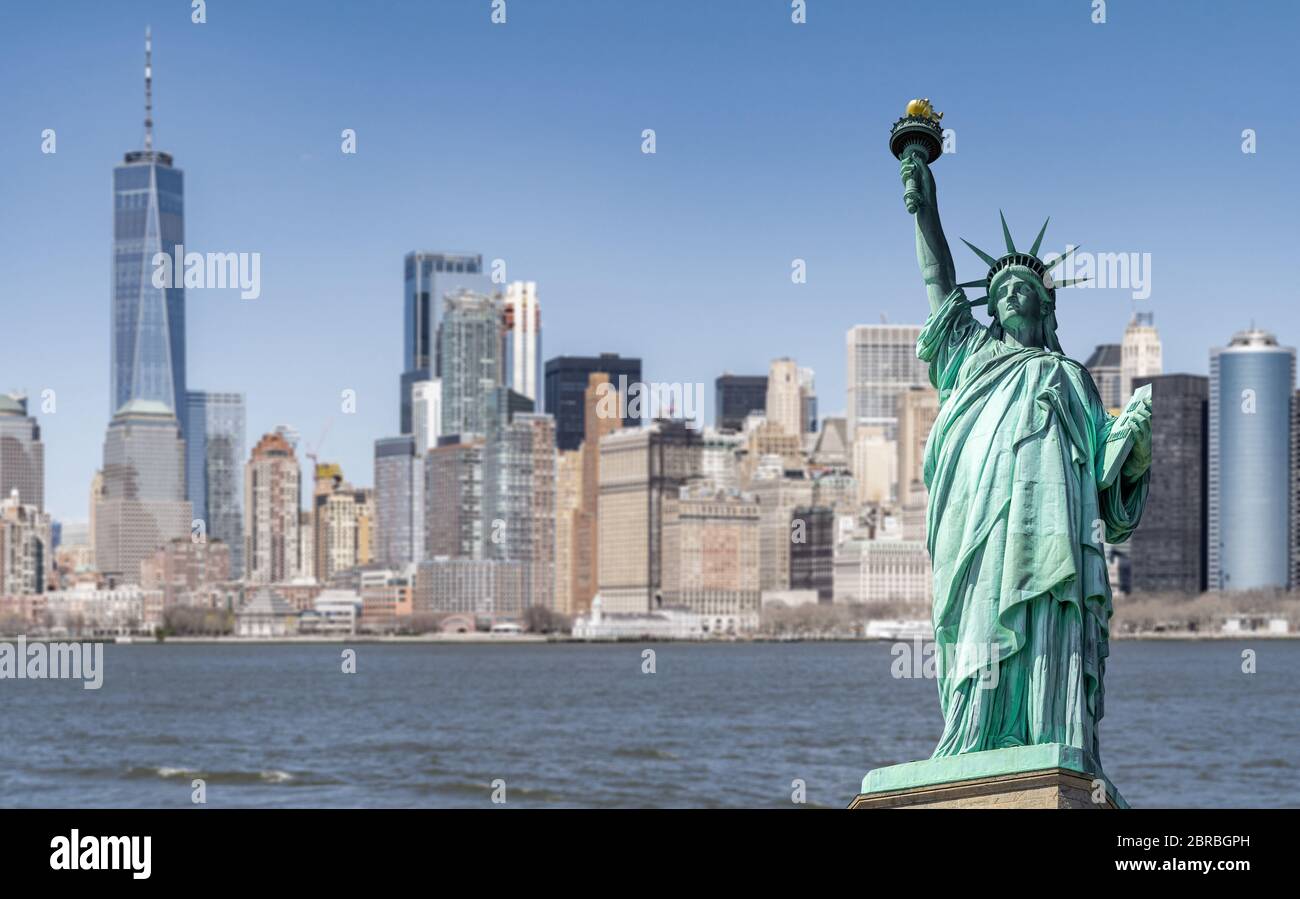 Statue of Liberty with Manhattan downtown Skylines building in ...