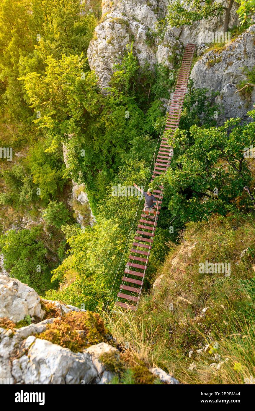 Man walking on via ferrata trail, Casa Zmeului, Romania Stock Photo - Alamy