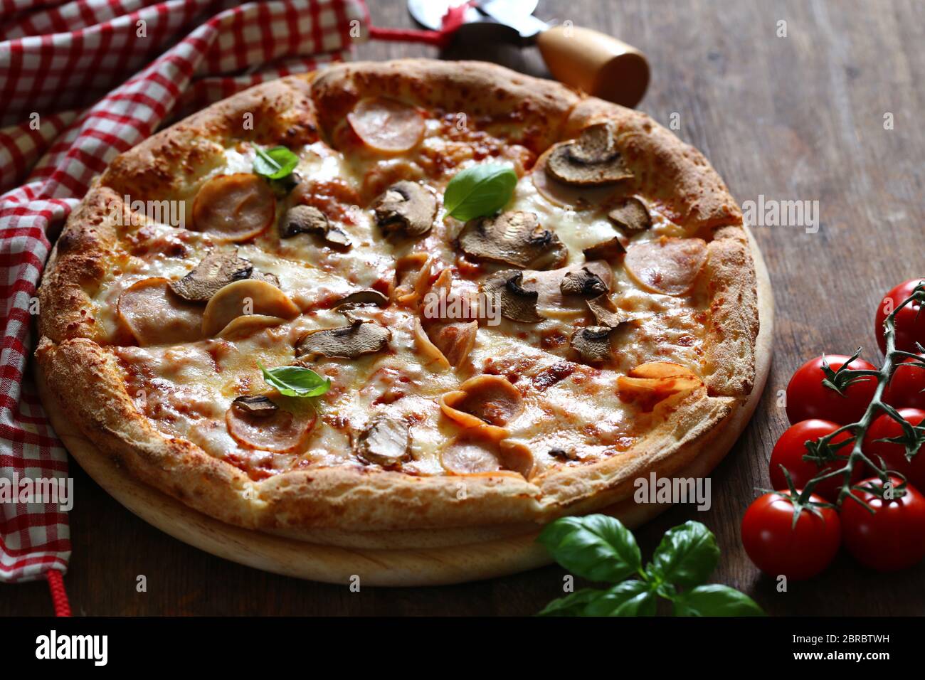 homemade pizza with ham and mushrooms Stock Photo - Alamy