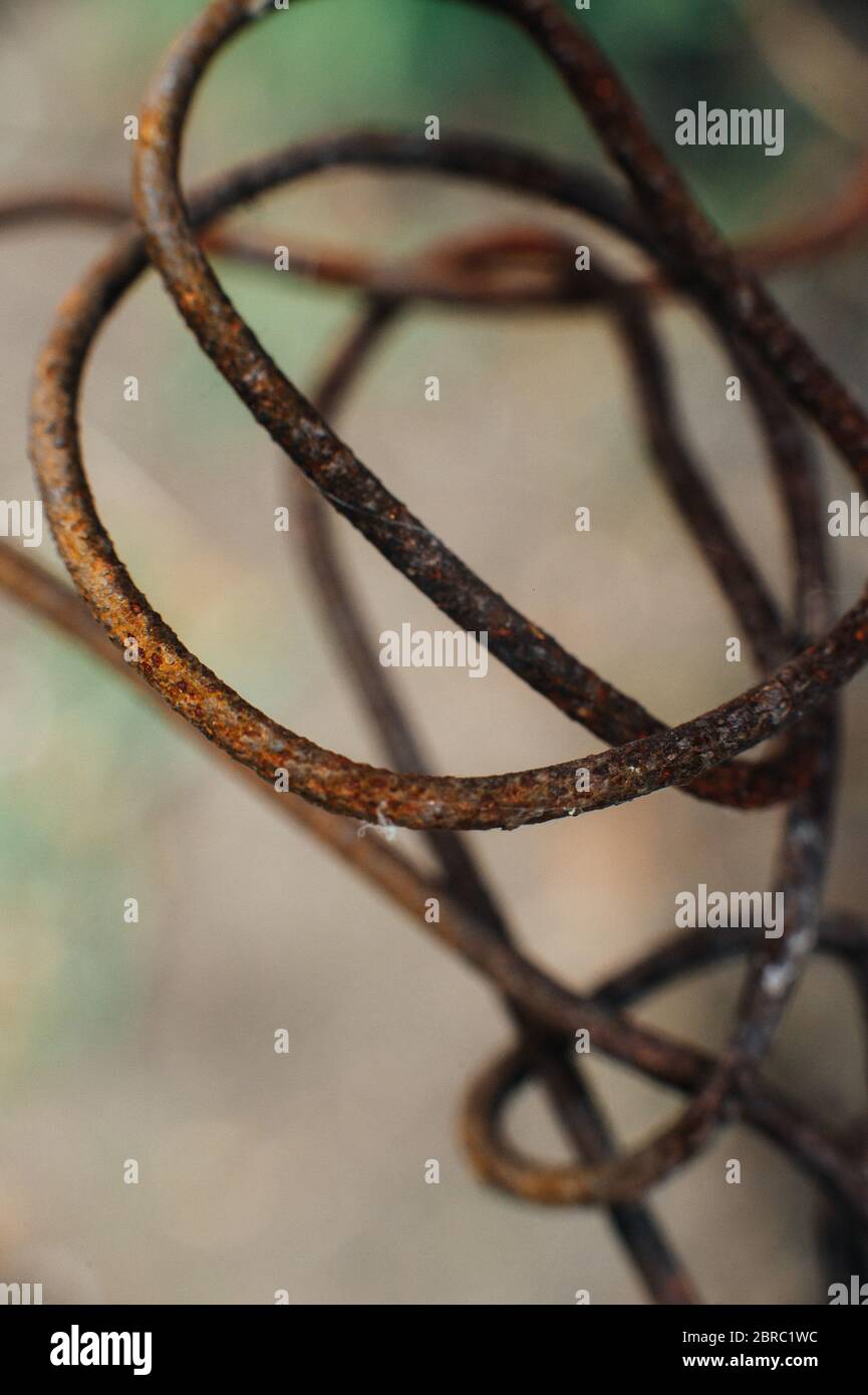Rusty iron wire. Old mesh netting. Pieces of wire. Scrap metal. Close ...